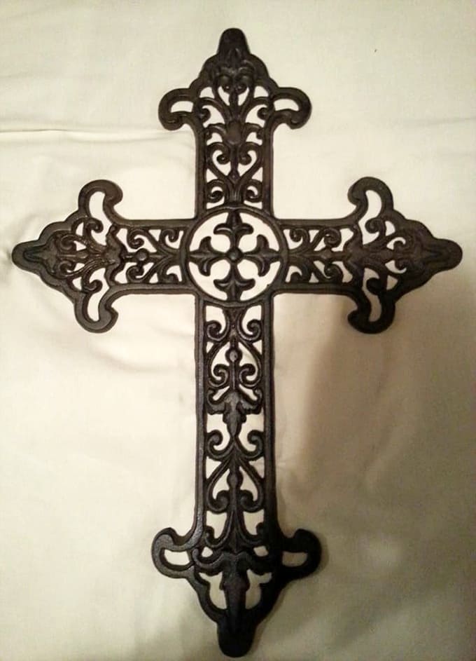 Ornate cast iron crosses at Red's bring gothic elegance to any wall, proving that religious art can be both beautiful and surprisingly affordable.