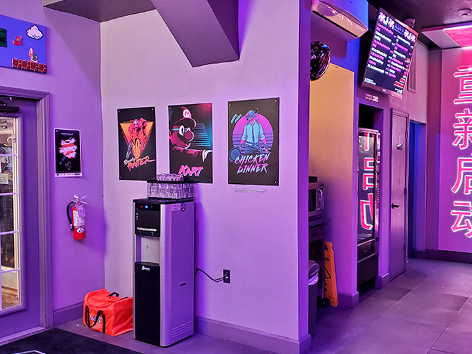 The retro-futuristic hallway leads gamers deeper into the arcade labyrinth, each poster a breadcrumb trail of pop culture nostalgia.