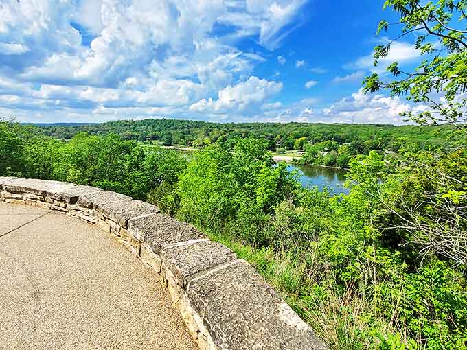 The stone wall frames a postcard-perfect view of the Rock River valley, where water and woodland meet in perfect harmony.