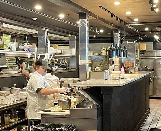 The open kitchen lets you watch the magic happen, where skilled hands transform fresh ingredients into the dishes that keep people coming back repeatedly.