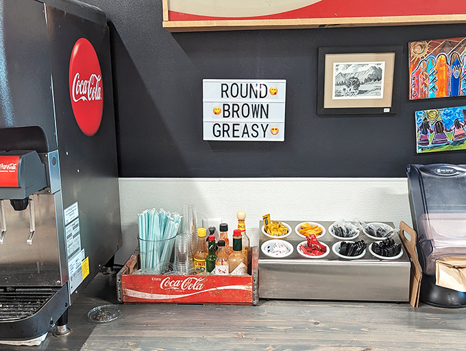"Round, Brown & Greasy" proclaims the sign at the condiment station, where hot sauces and toppings await your personal touch.