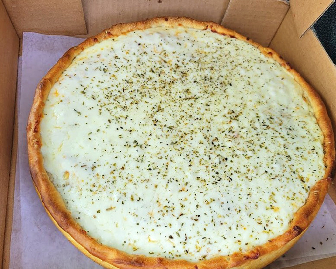 Their signature white pizza &ndash; a beautiful canvas of creamy cheeses and herbs that proves tomato sauce isn't always necessary.