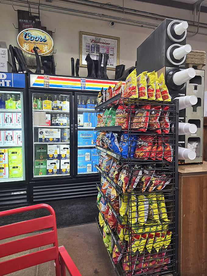 The cold drink section stands like a colorful oasis, promising instant relief from desert heat through a rainbow of bottled salvation.