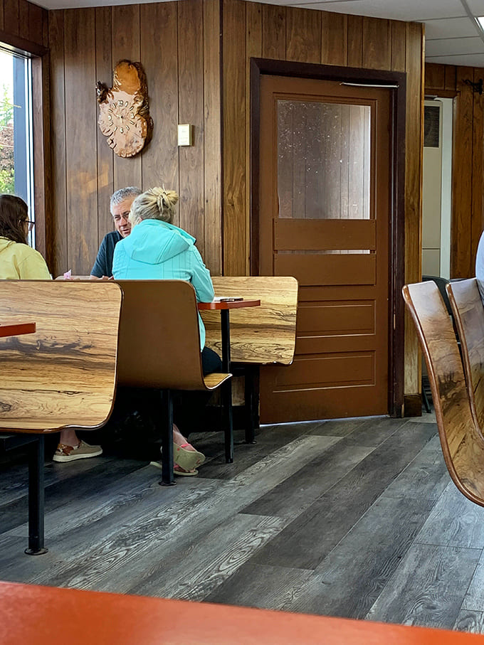Wood paneling and comfortable seating create an atmosphere that encourages lingering over that second cup of coffee and last bite of omelet.