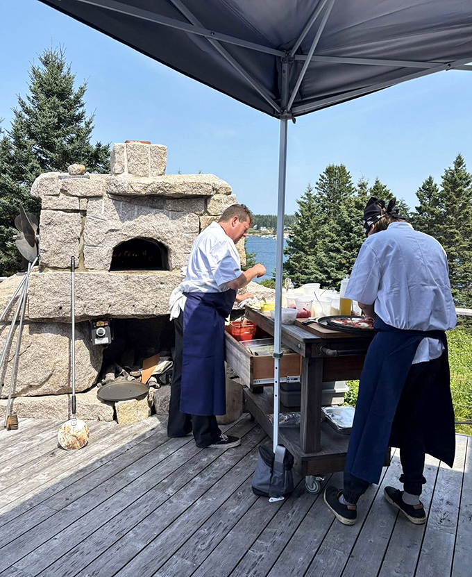 Culinary wizards at work beside their stone oven &ndash; watching these chefs prepare wood-fired creations is dinner and a show rolled into one.