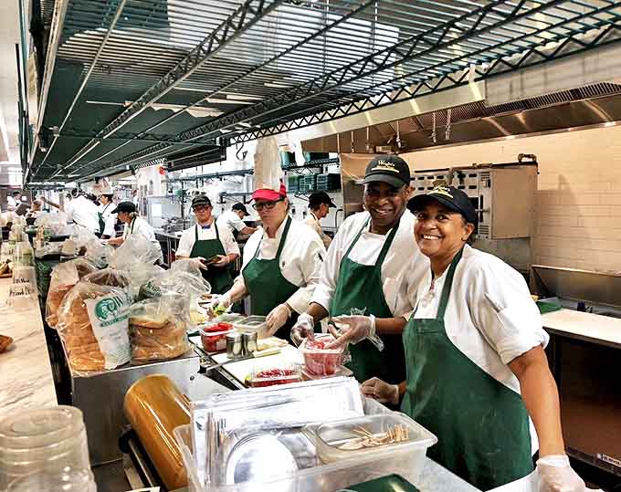 The kitchen team works their magic with practiced precision, creating edible memories one sandwich at a time.