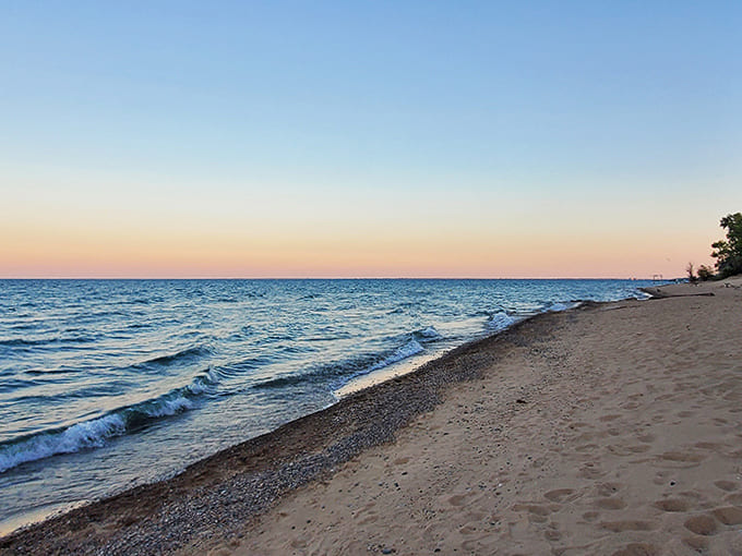Sunset transforms Lake Huron into a canvas of colors, when even teenagers put down their phones to appreciate nature's nightly show.
