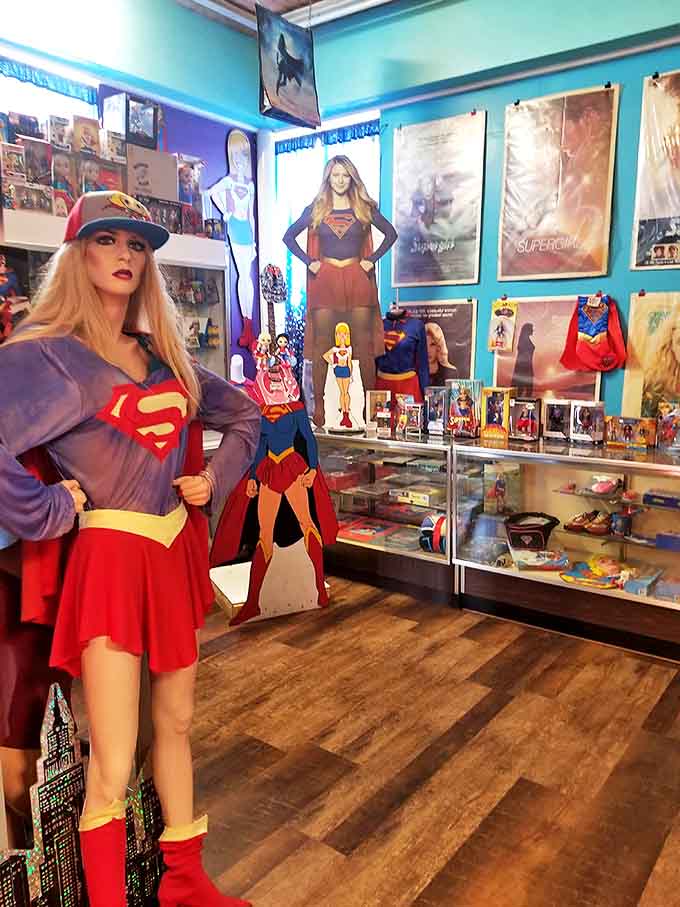 The Supergirl display celebrates Superman's cousin with posters and memorabilia, proving that superhero greatness runs in the family and looks fantastic in red and blue.
