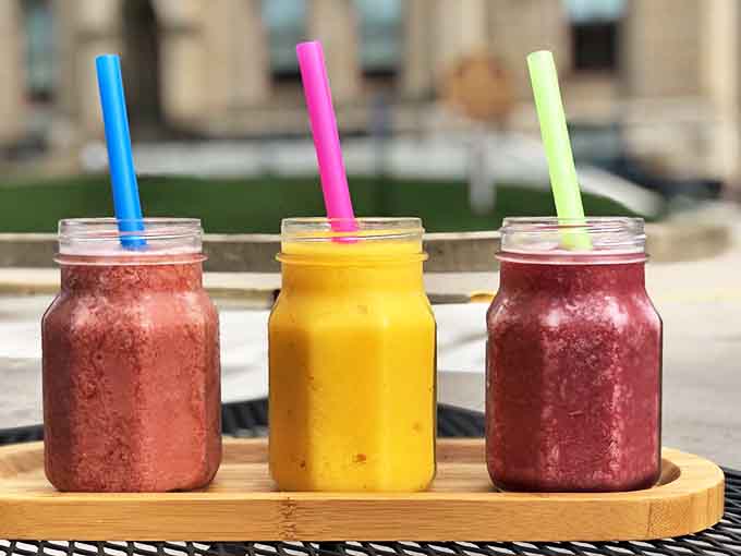 Mason jar smoothies lined up like summer's greatest hits album &ndash; vibrant, refreshing, and packed with enough fruit to count as breakfast.