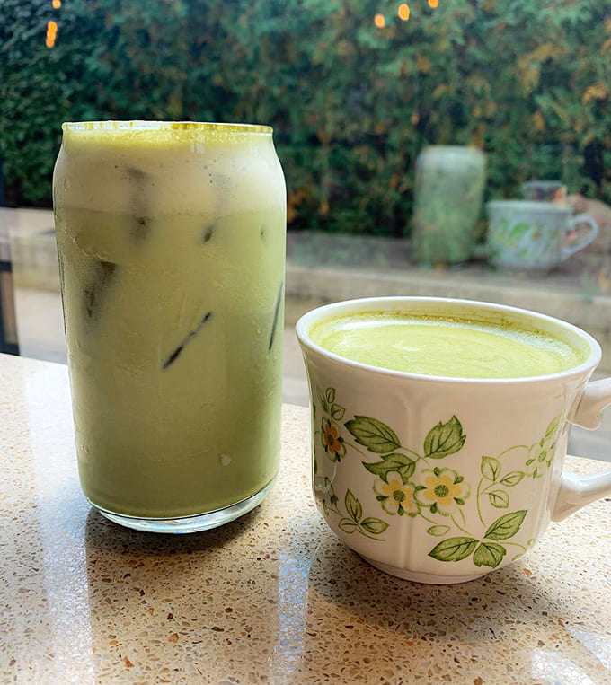 Matcha two ways: traditional hot preparation alongside its iced, milky counterpart &ndash; both vibrant green promises of gentle energy.