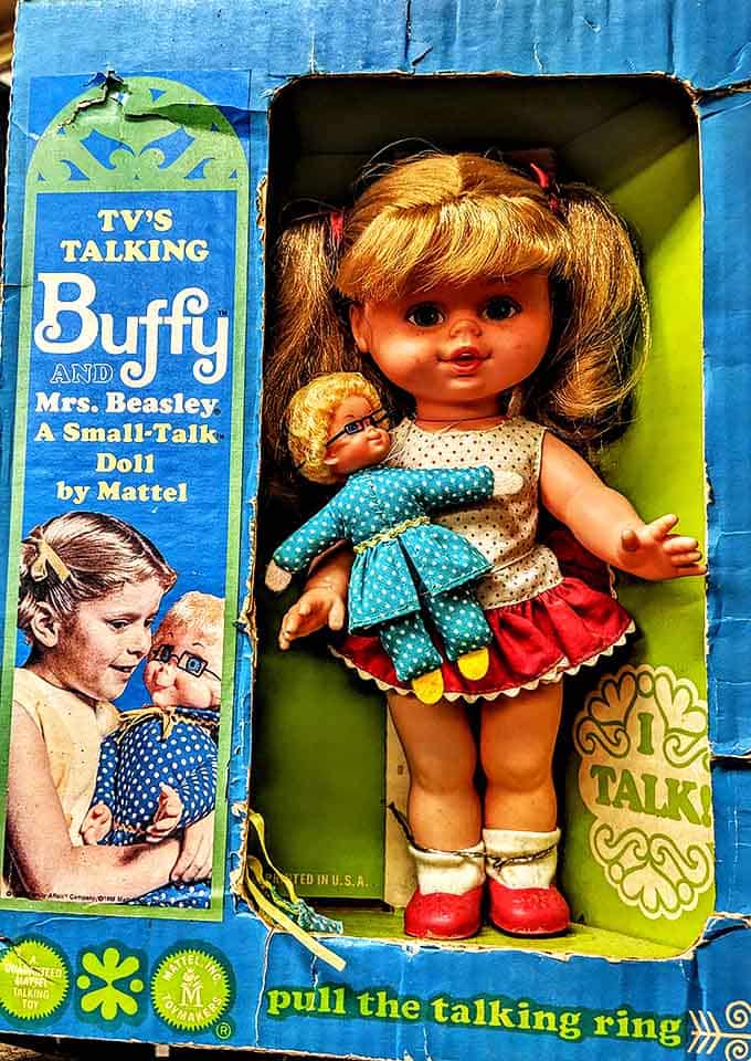This vintage Buffy doll, still in her original packaging, waits patiently to be discovered by someone who remembers pulling her talking ring in childhood.