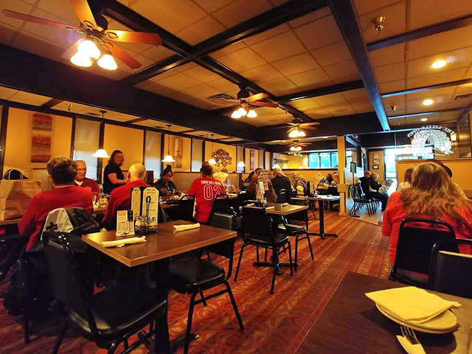 The restaurant buzzes with energy as diners in team colors gather, turning this eatery into a community hub on game day.