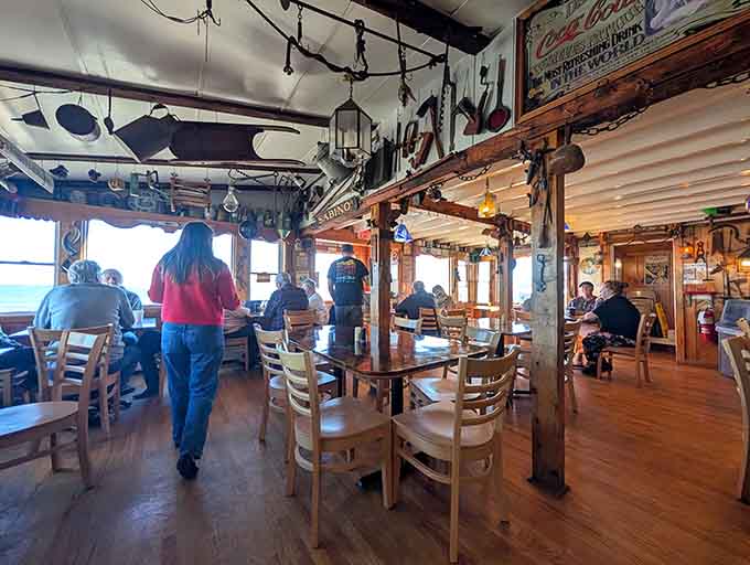 Happy diners dig into their seafood feasts, proving that great food and beautiful views create perfect moments.
