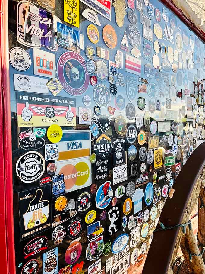 Hundreds of stickers and patches from around the world cover the walls, showing how this little Arizona motel has captured hearts internationally.