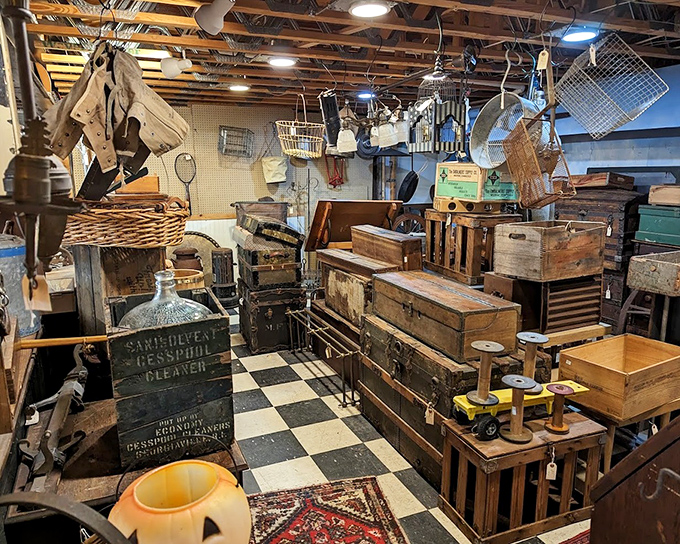 Wooden crates and vintage trunks create a nostalgic landscape in this basement section, perfect for industrial-chic decorators.