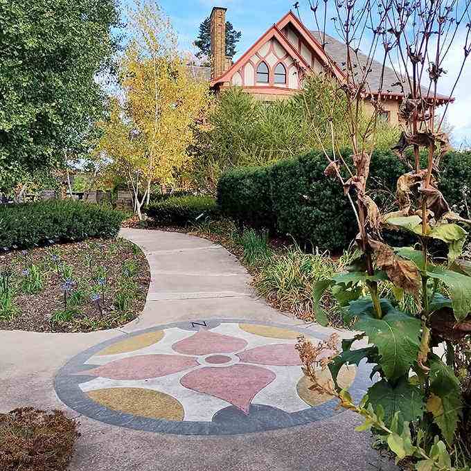 A flower-lined compass rose points the way, though in a garden this beautiful, getting lost is half the fun.