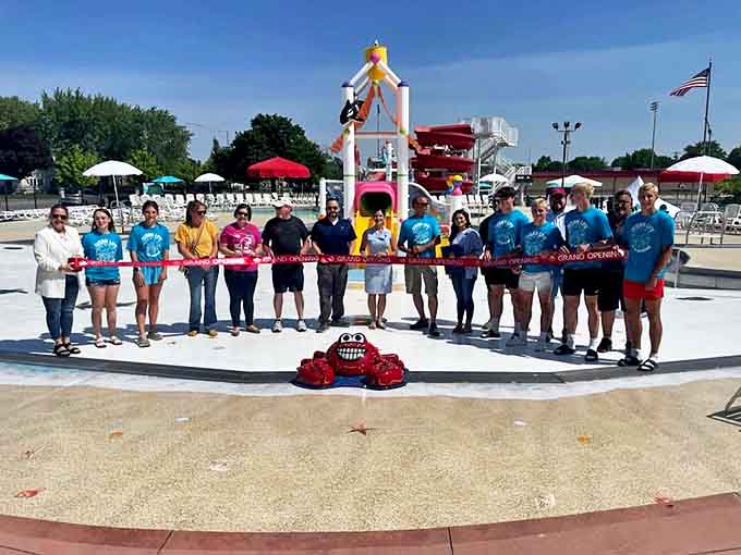 The dedicated staff celebrates another successful season with a ribbon-cutting ceremony &ndash; their enthusiasm as refreshing as the water itself.