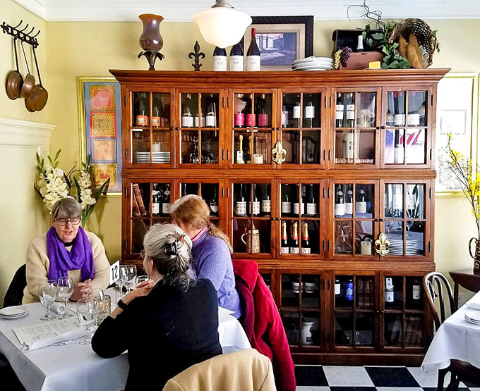 The wine cabinet stands as a testament to thoughtful curation, with bottles waiting to complement your European culinary journey.