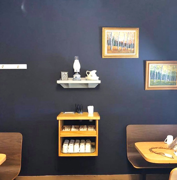 Blue room serenity: The navy walls in this dining section create a calming backdrop for enjoying Father's hearty comfort food.