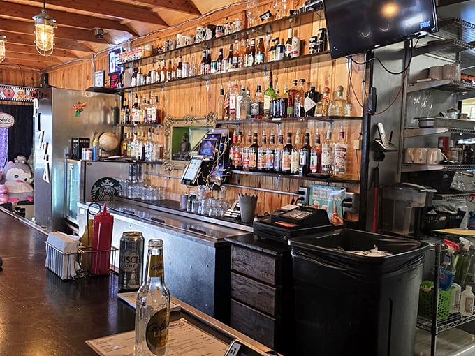 The bar area gleams with possibility, offering everything from craft beers to classic cocktails, because great burgers deserve equally great beverage companions.