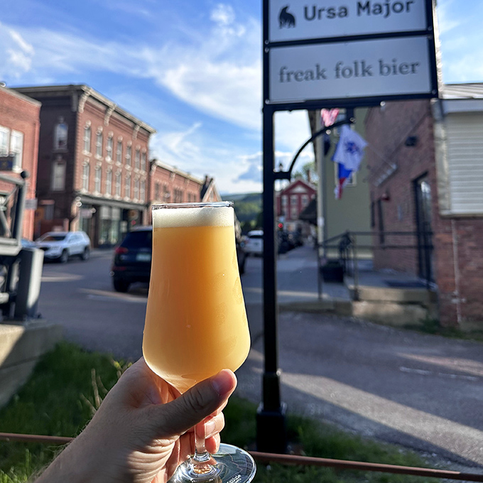 A golden glass of Vermont craft beer catches the late afternoon light &ndash; liquid sunshine brewed with local passion and global inspiration.