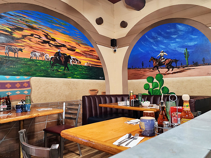 Vibrant murals transport diners to the heart of cowboy country, where horses roam free and the desert sky stretches endlessly.