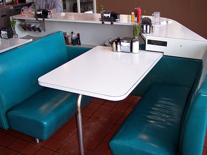 Cozy booth seating invites you to settle in and stay awhile – these burgers deserve your full, undivided attention.