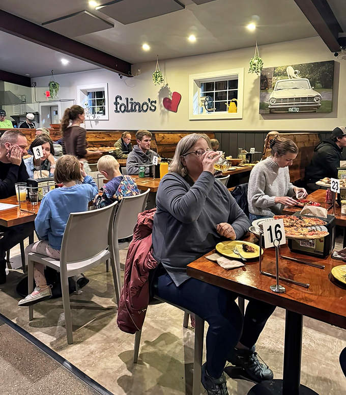 A bustling evening at Folino's, where pizza brings people together in delicious harmony.