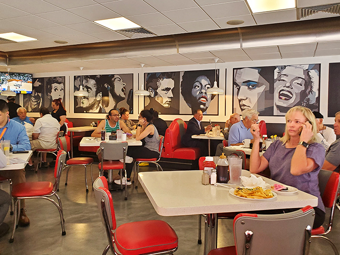 The restaurant fills with a diverse crowd, from locals to tourists, all enjoying the unpretentious atmosphere.