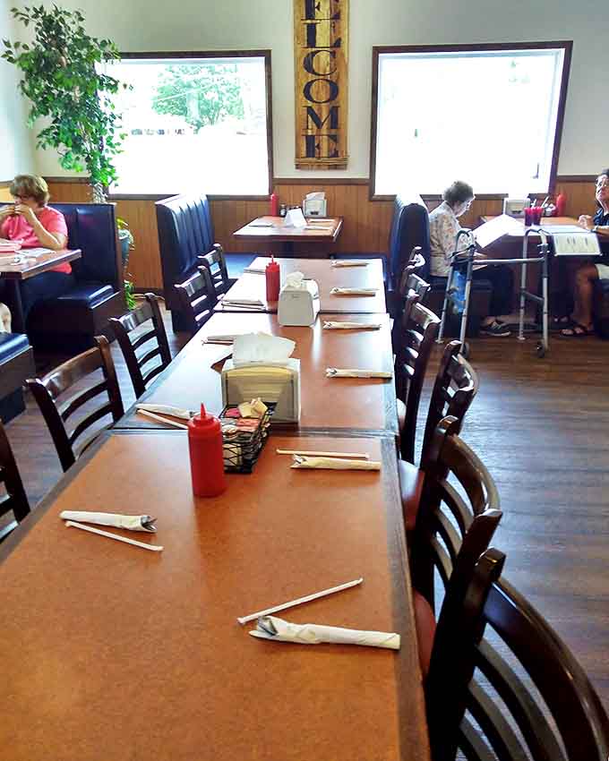 Long tables set and ready for the next wave of hungry diners, because at Eddie's, there's always another satisfied customer on the way.