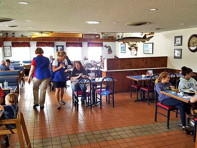 The dining room buzzes with conversation as servers navigate between tables with the efficiency that comes from years of experience.