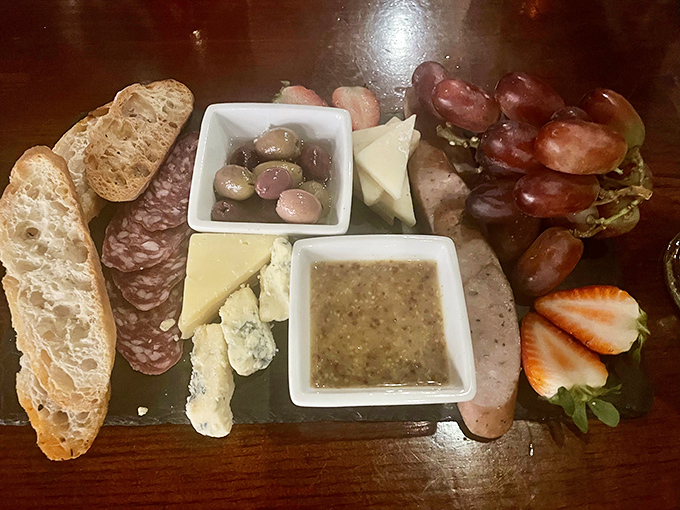 A perfectly curated cheese and charcuterie board showcases Vermont's artisanal producers, creating a shareable prelude to the main event or a meal unto itself.