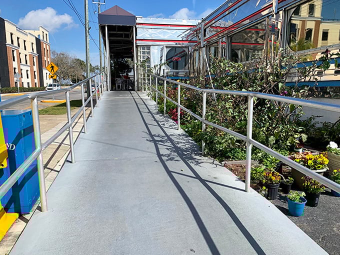 The pathway to breakfast paradise, flanked by greenery and promising delicious rewards at the end of your journey.