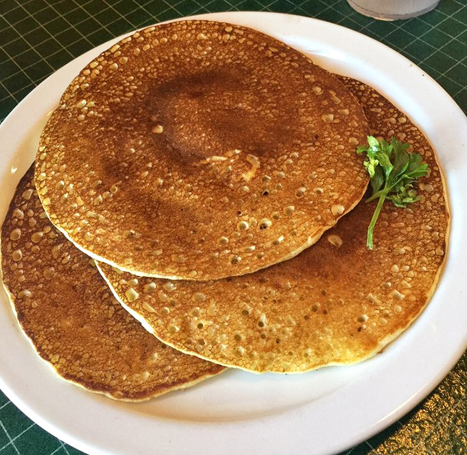 Golden-brown and perfectly round, these pancakes promise fluffy interiors that eagerly await their maple syrup bath – breakfast doesn't get more comforting than this.