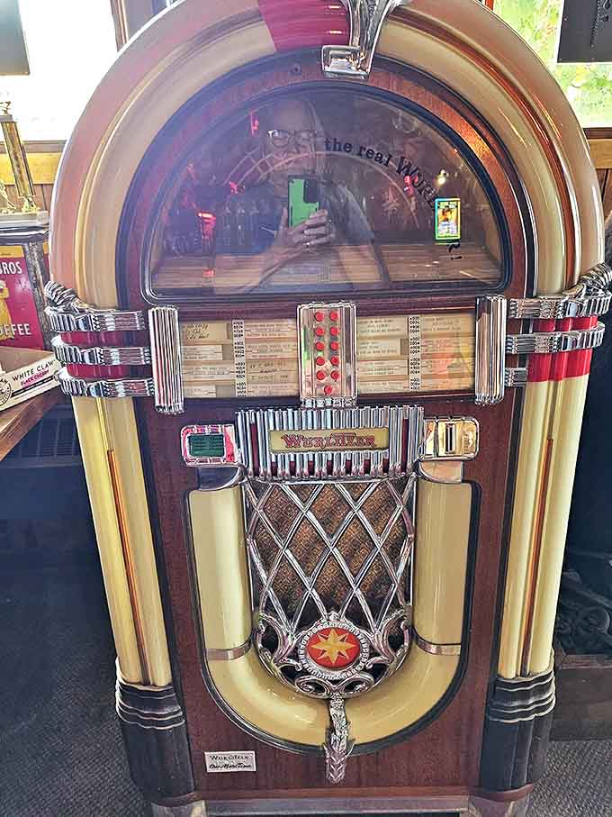 The vintage jukebox glows with nostalgic warmth, offering the perfect soundtrack for an evening spent among artifacts from another era.
