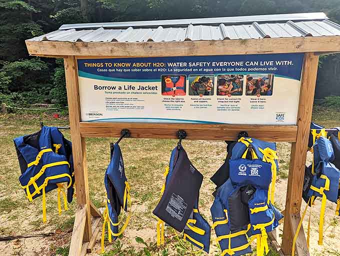 Safety first! The life jacket station stands ready to transform swimming novices into confident water explorers.