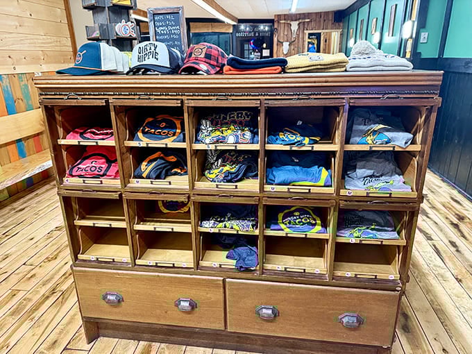 Hungry Hippie swag displayed in vintage wooden cubbies &ndash; because sometimes a t-shirt is the only appropriate souvenir for life-changing taco experiences.
