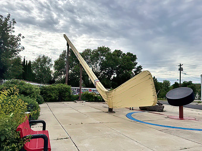 From behind, the giant stick creates an almost surreal landscape &ndash; a slice of sports fantasy dropped into the middle of a very real Minnesota town.