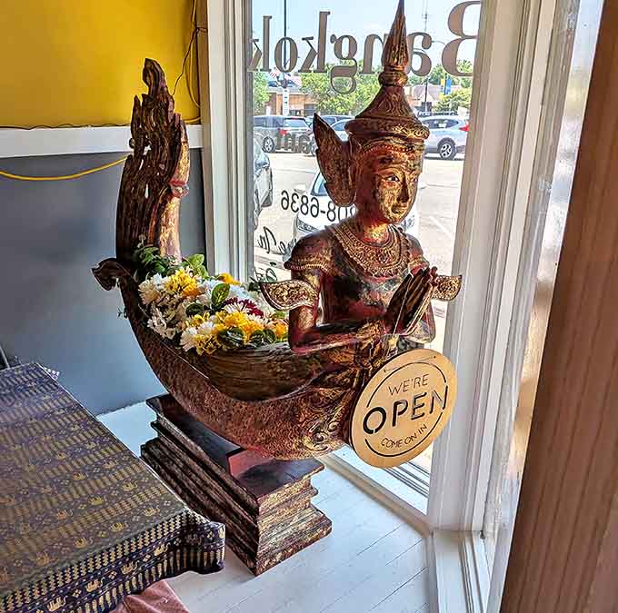 This ornate Thai statue greets visitors with a traditional "wai" gesture, setting the tone for an authentic cultural experience from the moment you enter.