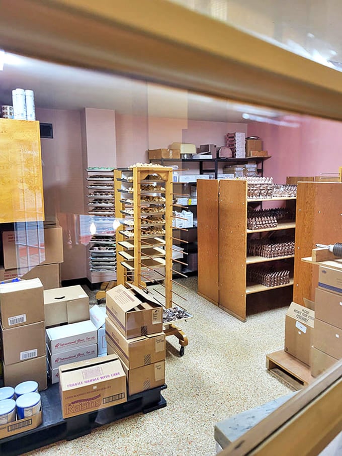 A rare glimpse into the production area reveals the behind-the-scenes magic &ndash; racks of cooling chocolates waiting to make their grand entrance to the display cases.