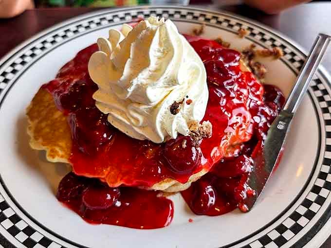 Strawberry pancakes that blur the line between breakfast and dessert &ndash; fluffy discs of joy crowned with berries and a cloud of whipped cream.