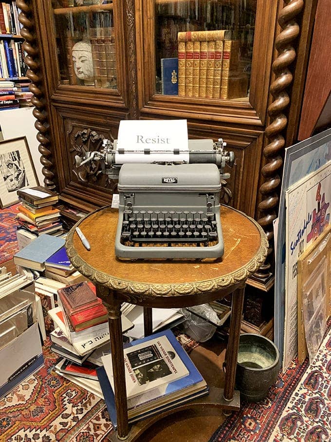 This ornate cabinet houses treasures behind glass, its carved details and twisted columns showcasing craftsmanship from another era.