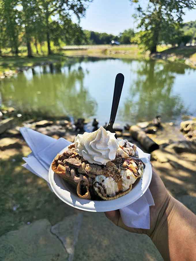 Lakeside dessert perfection &ndash; a waffle bowl sundae poses majestically against the mill pond backdrop, proving nature and ice cream are perfect companions.