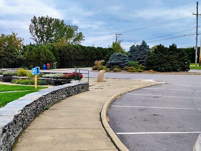 Stone walls guide visitors along paths that promise discovery, the curved walkway building anticipation with every step.