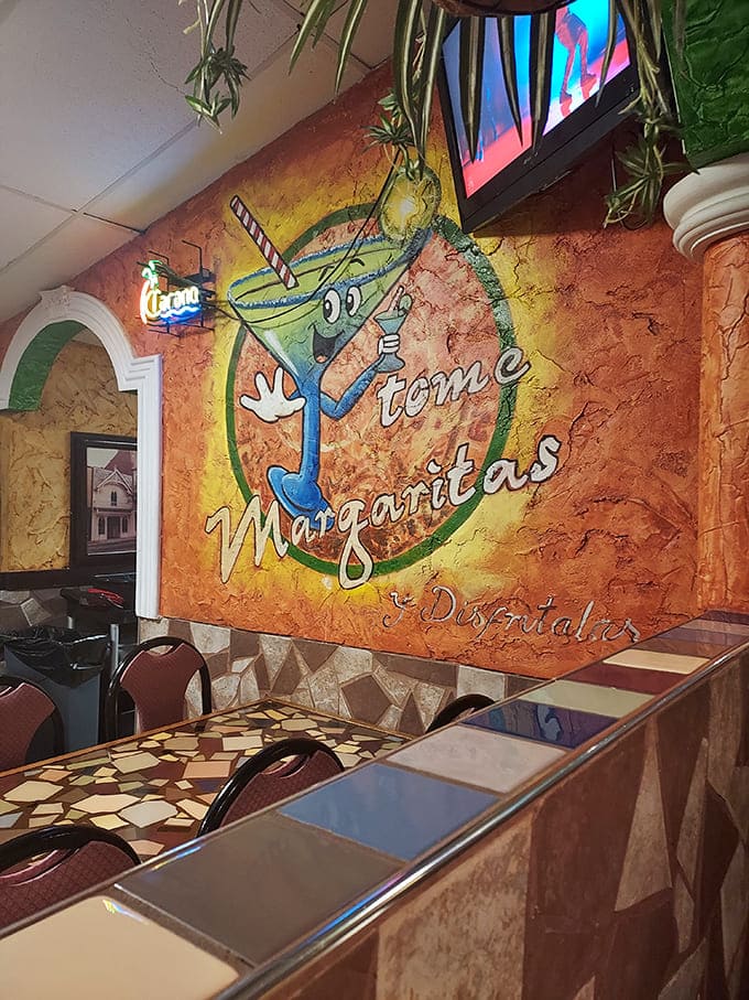 The whimsical margarita character on the wall seems to say, "Yes, you definitely deserve another round!" Who are we to argue?