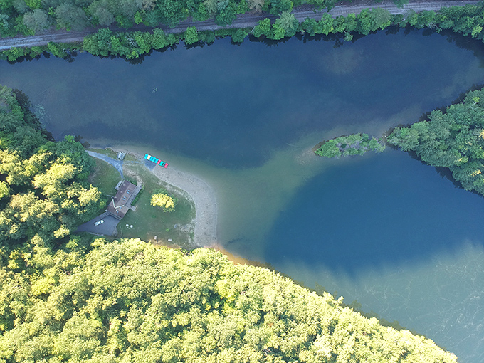 Bird's-eye brilliance: This aerial perspective reveals Emerald Lake's perfect setting, cradled by Vermont's verdant mountains like a precious gem.