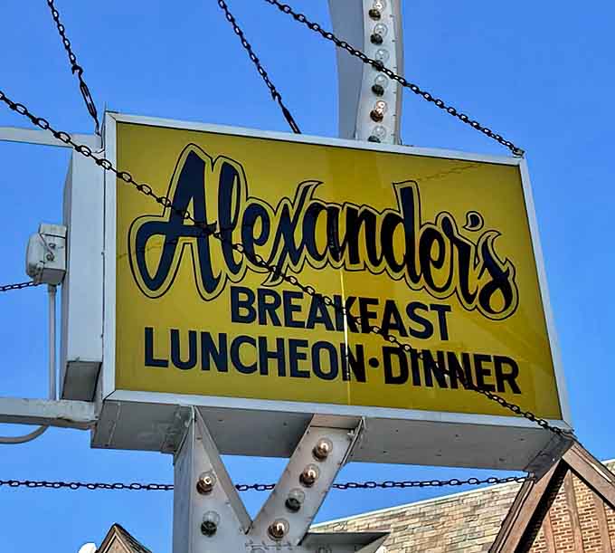 The iconic yellow Alexander's sign promises "Breakfast, Luncheon, Dinner" &ndash; three simple words that have sustained this neighborhood institution through changing times and tastes.