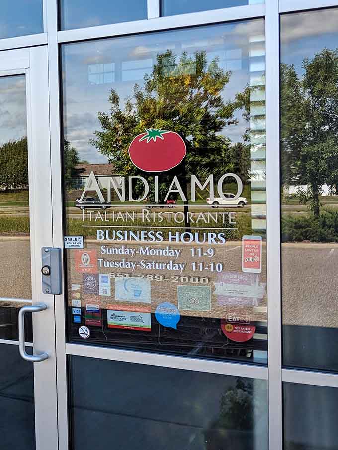Business hours posted clearly on the door, because knowing when you can get your pasta fix is important information.