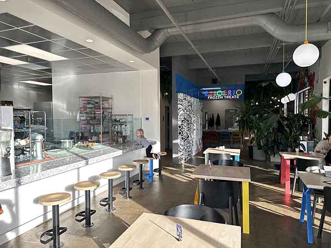 The dining area balances modern aesthetics with comfortable functionality, perfect for cupcake contemplation and coffee conversations.