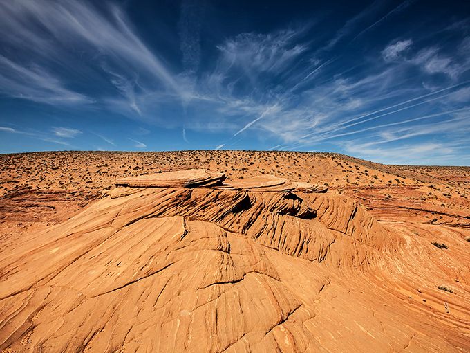Antelope Canyon's flowing sandstone walls look like they were carved by an artist with a very fluid imagination and unlimited patience.